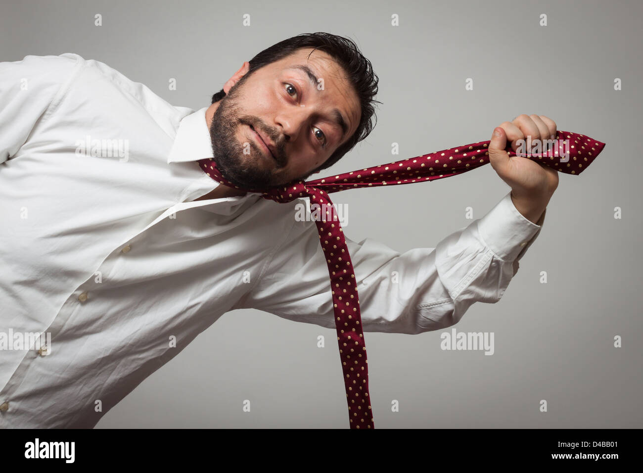 Pulling tie hi-res stock photography and images - Alamy