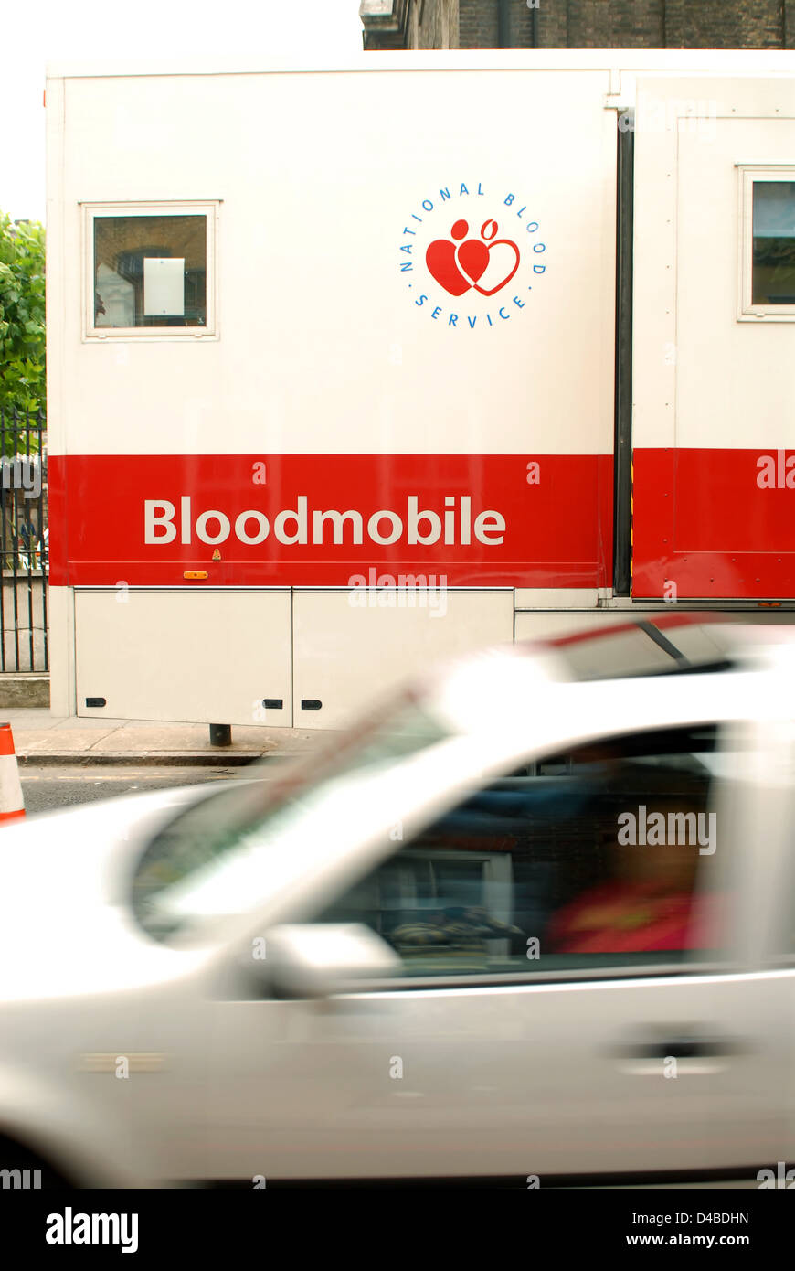 Mobile blood donating unit with passing car hi-res stock photography ...