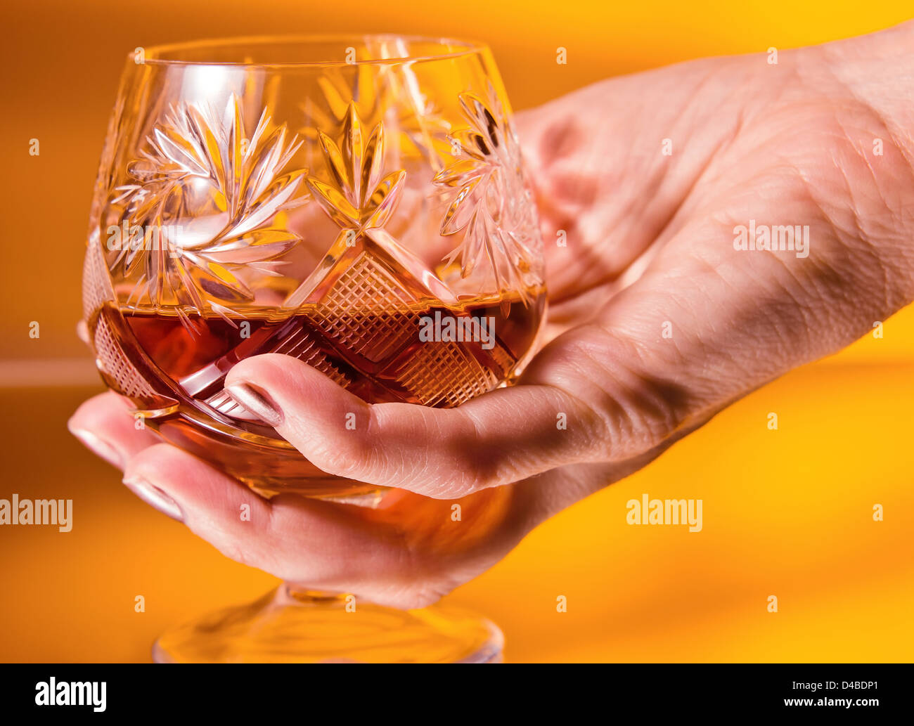 shot of a cut crystal glass containing brandy Stock Photo - Alamy