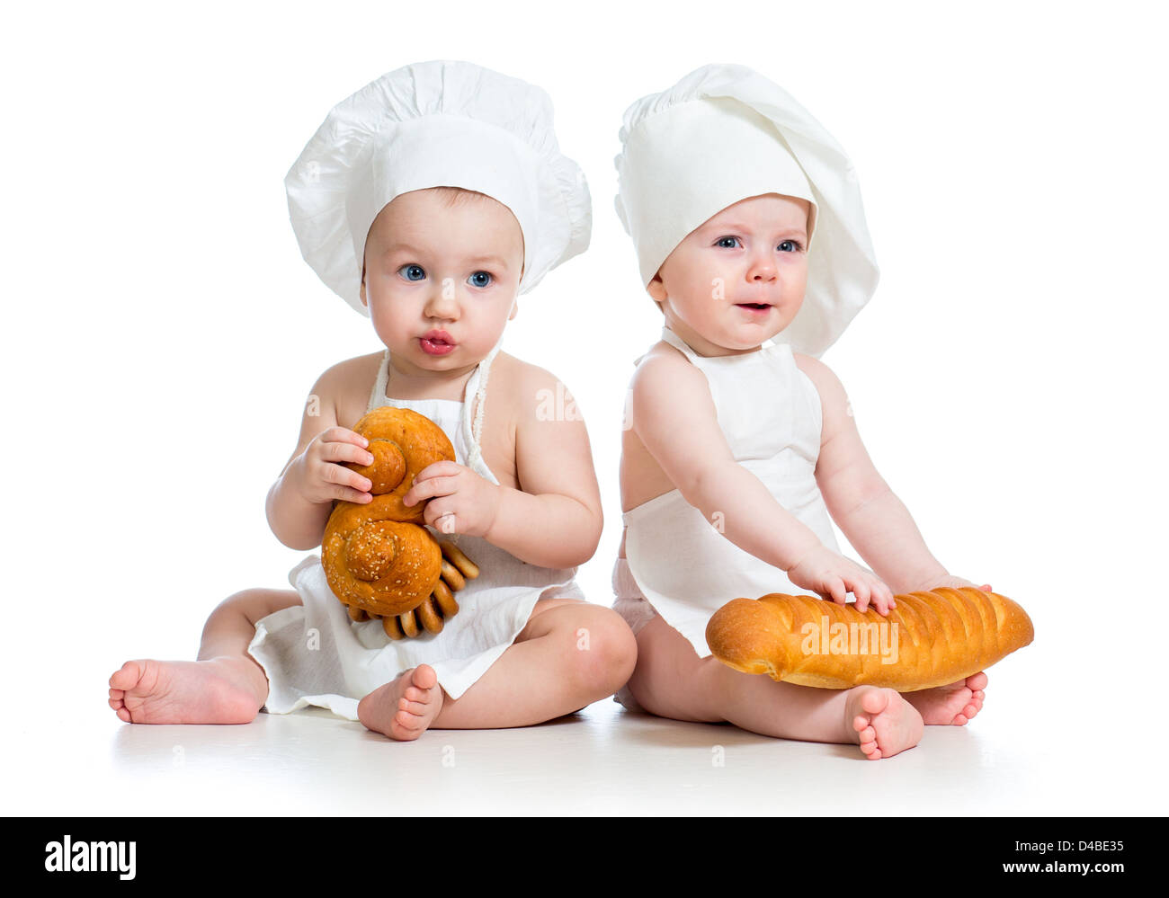 Little bakers kids boy and girl Stock Photo - Alamy