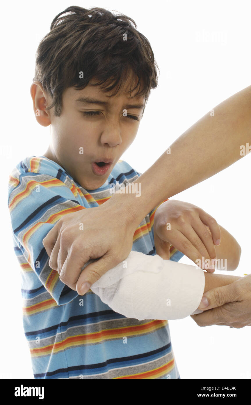 Boy having bandaged elbow hi-res stock photography and images - Alamy