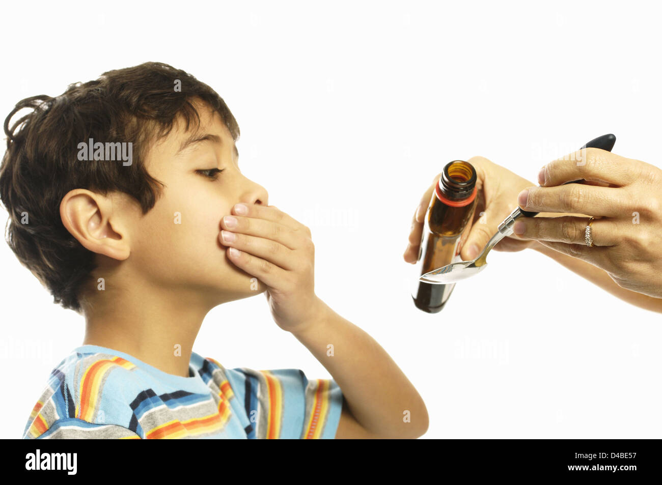 Boy refusing take cough syrup hi-res stock photography and images - Alamy