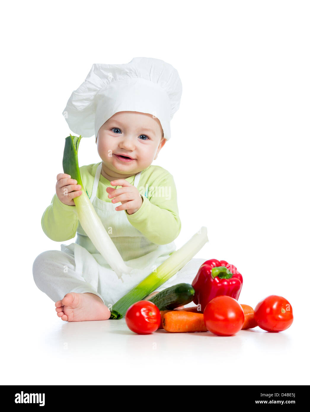 baby boy wearing a chef hat with healthy food vegetables Stock Photo ...