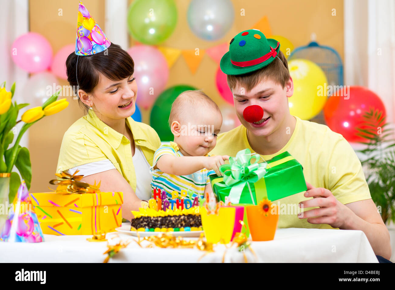 family celebrating first birthday of baby Stock Photo - Alamy
