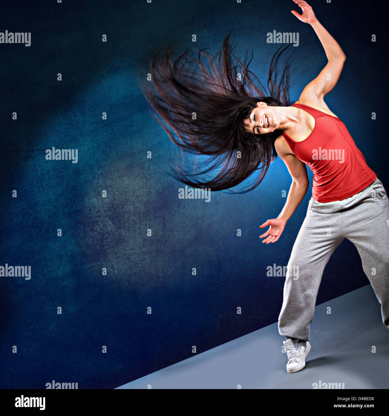 young woman in sport dress dancing zumba Stock Photo - Alamy