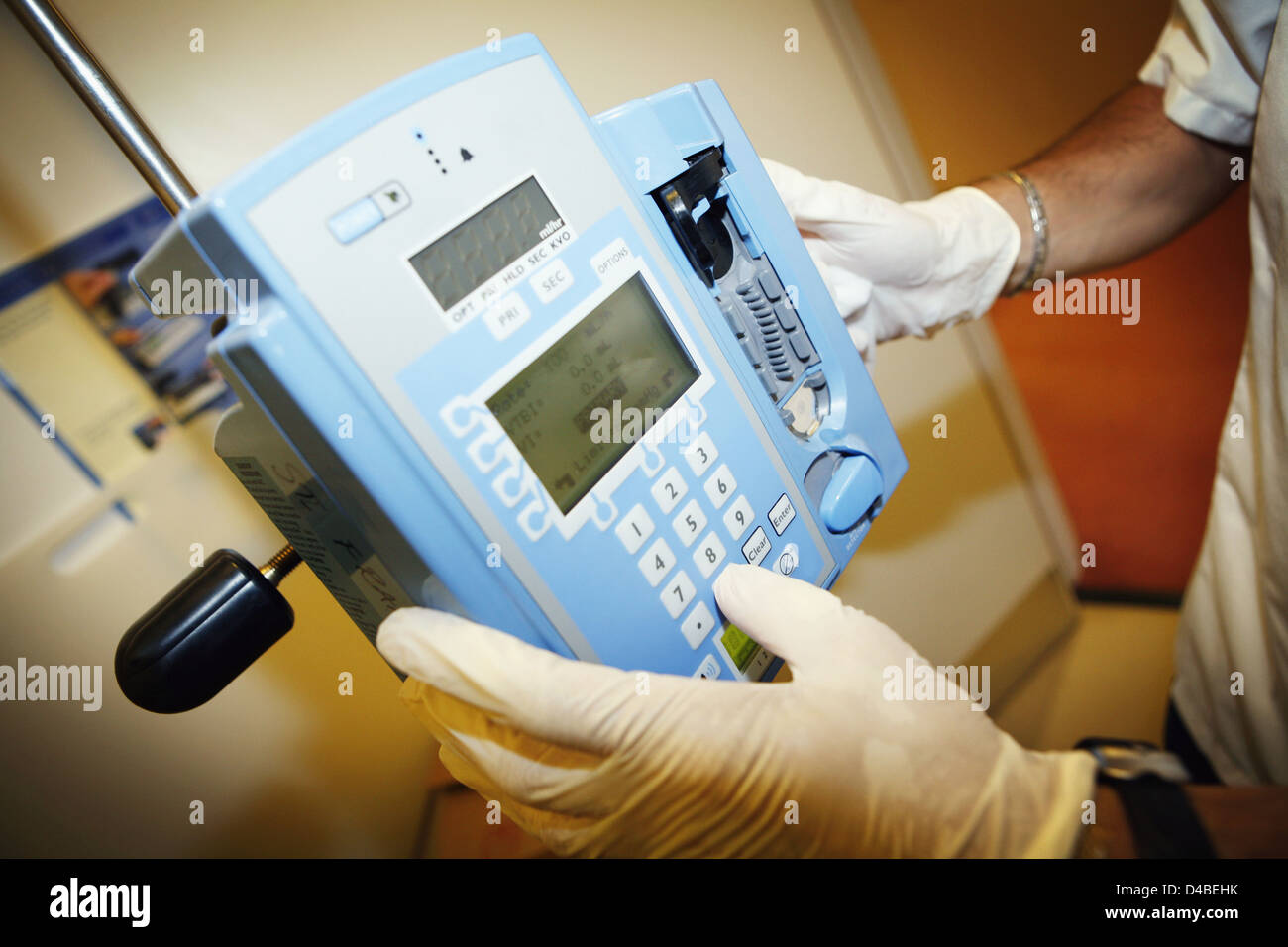 UK London Male nurse in London hospital checks dosage delivery rate ...