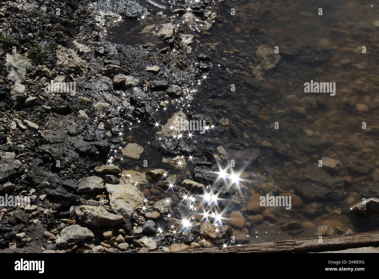 A sparkling clear stream with rocks Stock Photo - Alamy