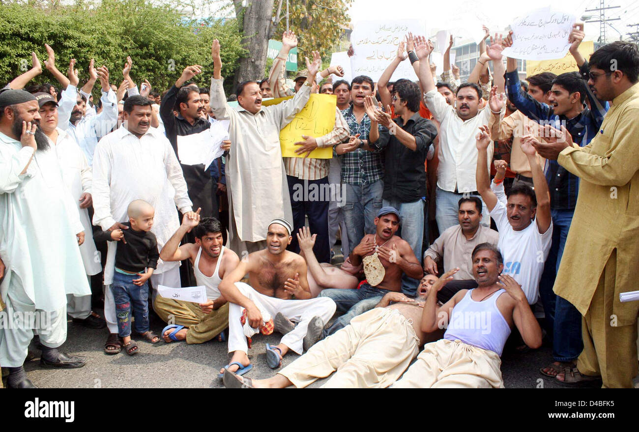 Employees of Water And Sanitation Agency (WASA) chant slogans for regularization of their jobs ...