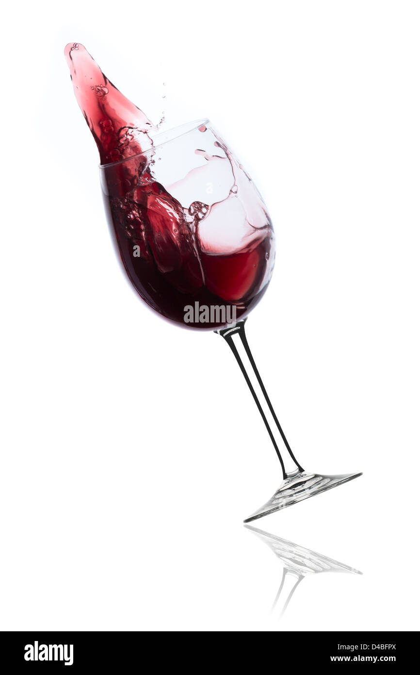 red wine splashing out of a glass, isolated on white Stock Photo - Alamy