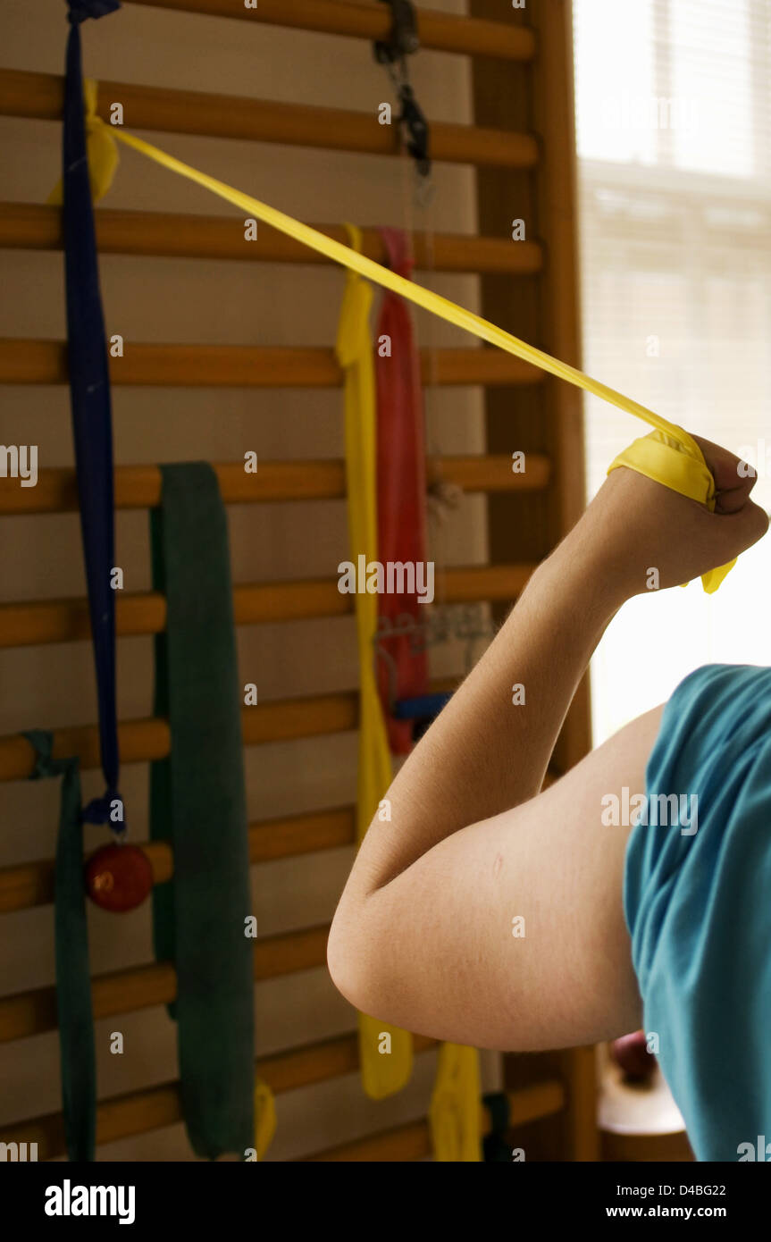 Physiotherapy patient exercises with rubber tension lines Stock Photo ...