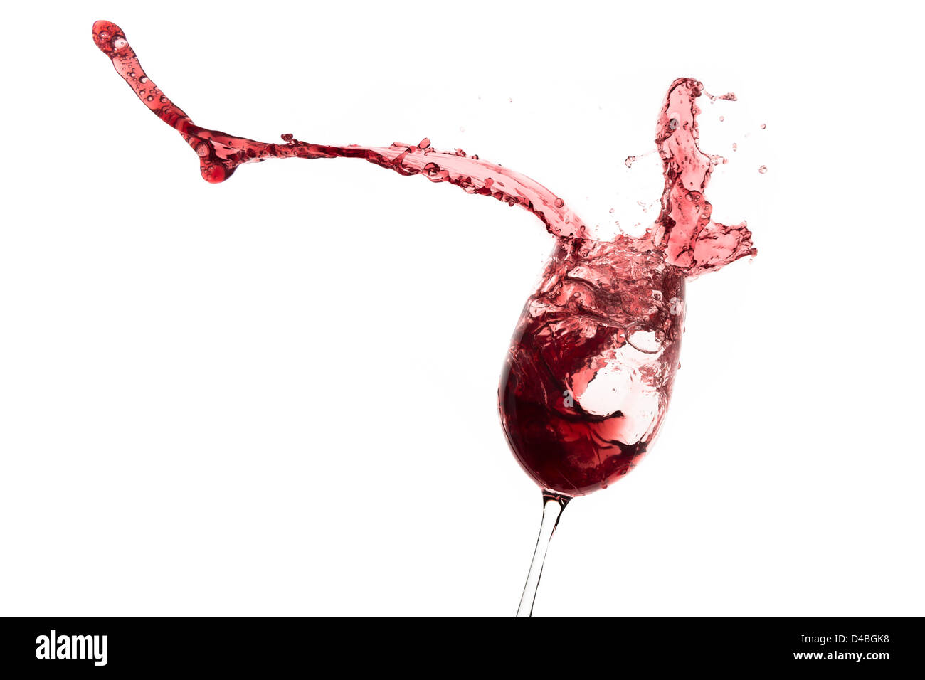 red wine splashing out of a glass, isolated on white Stock Photo - Alamy