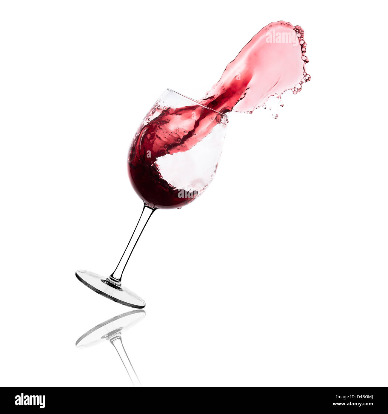 red wine splashing out of a glass, isolated on white Stock Photo - Alamy