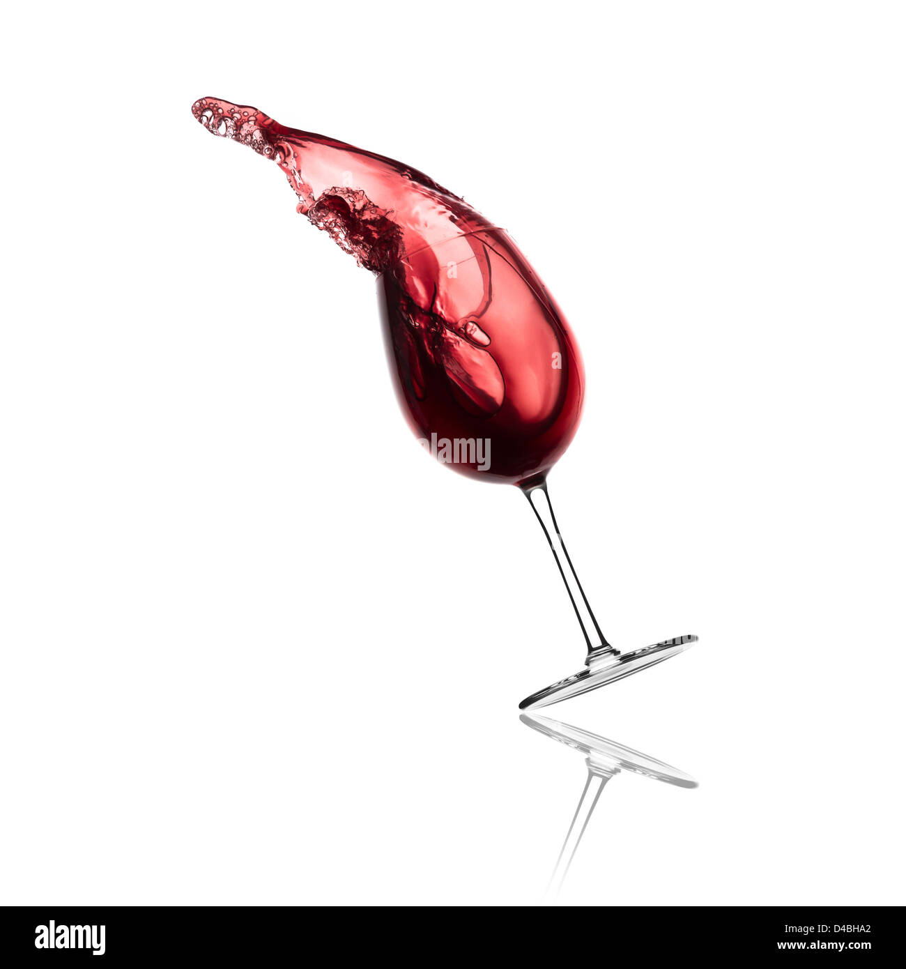 red wine splashing out of a glass, isolated on white Stock Photo - Alamy