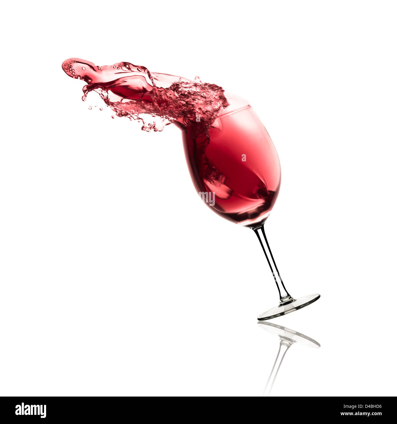 red wine splashing out of a glass, isolated on white Stock Photo - Alamy