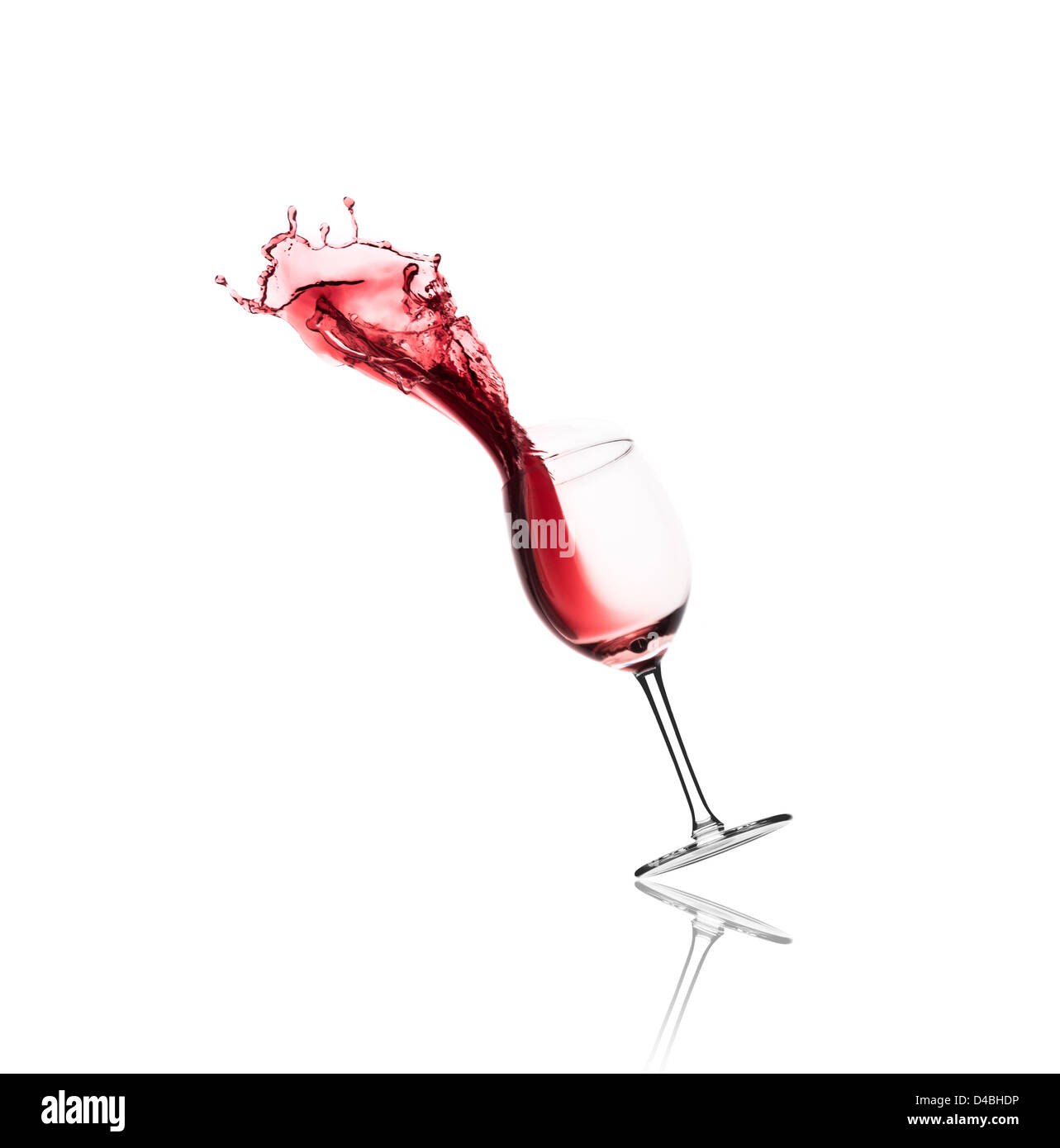 red wine splashing out of a glass, isolated on white Stock Photo - Alamy
