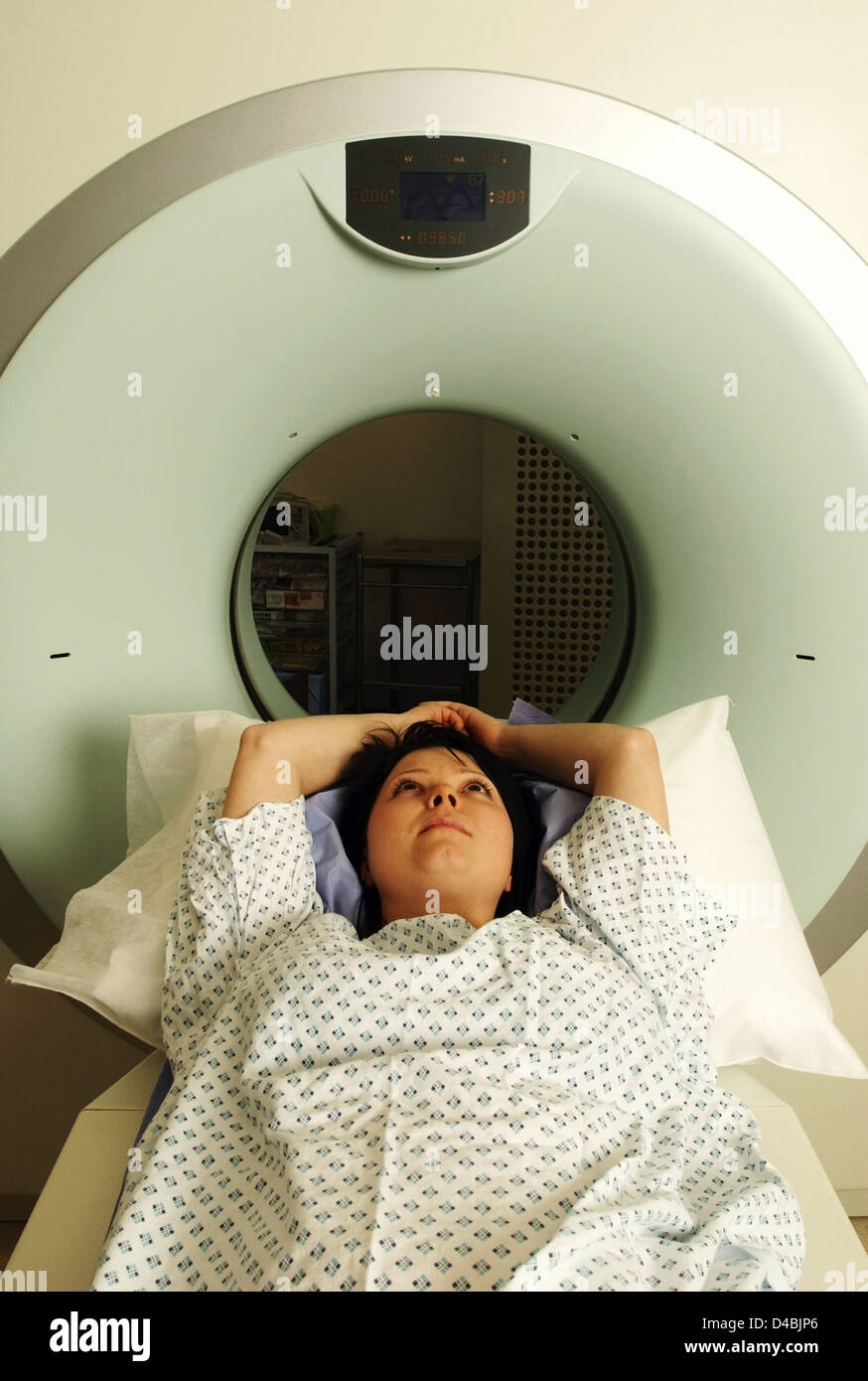 Patient on examination table of computed tomography scanner Stock Photo ...