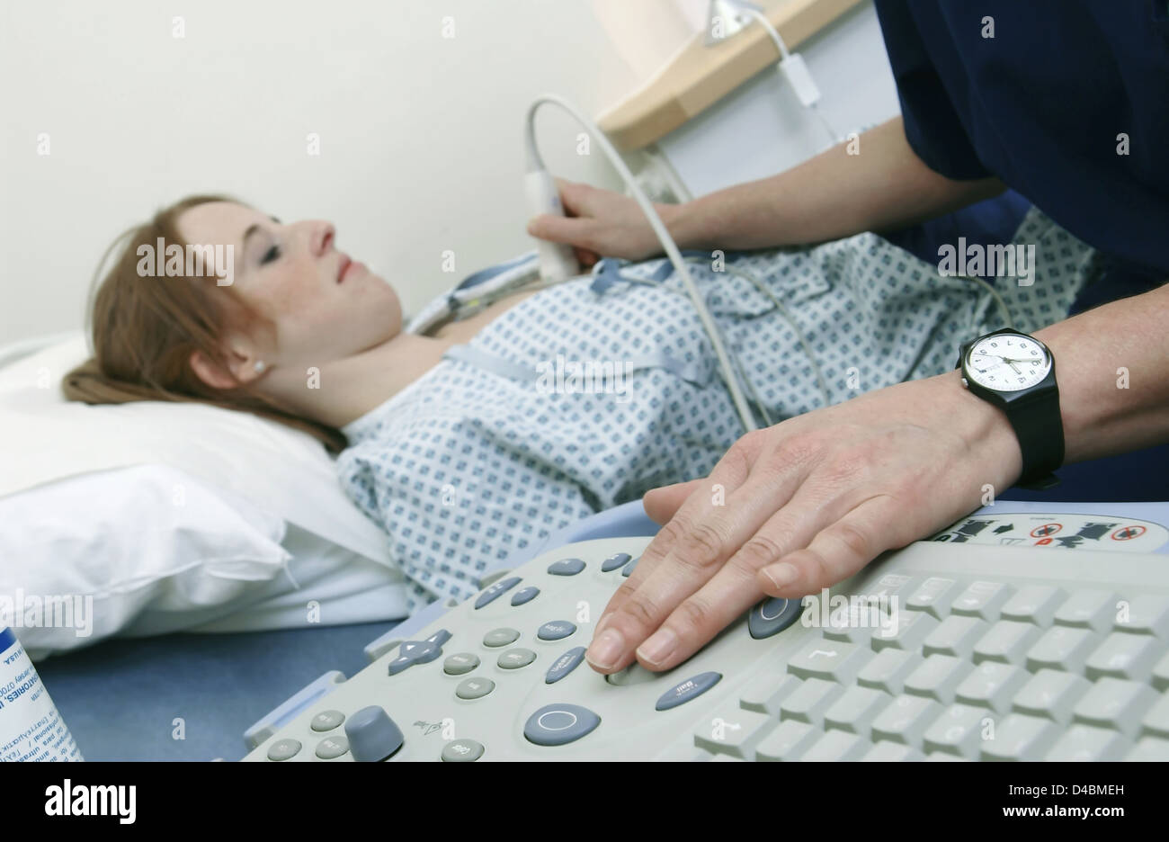 Cardiophysiologist scanning patients chest using ultra sound Stock ...