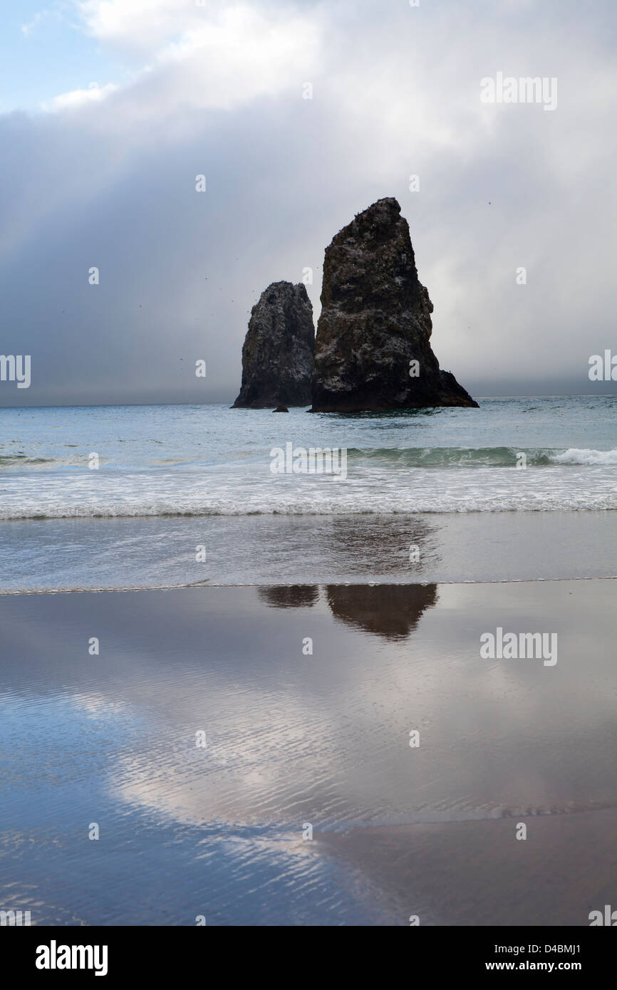 Rock formation in dramatic light, Cannon Beach, Oregon, USA Stock Photo ...