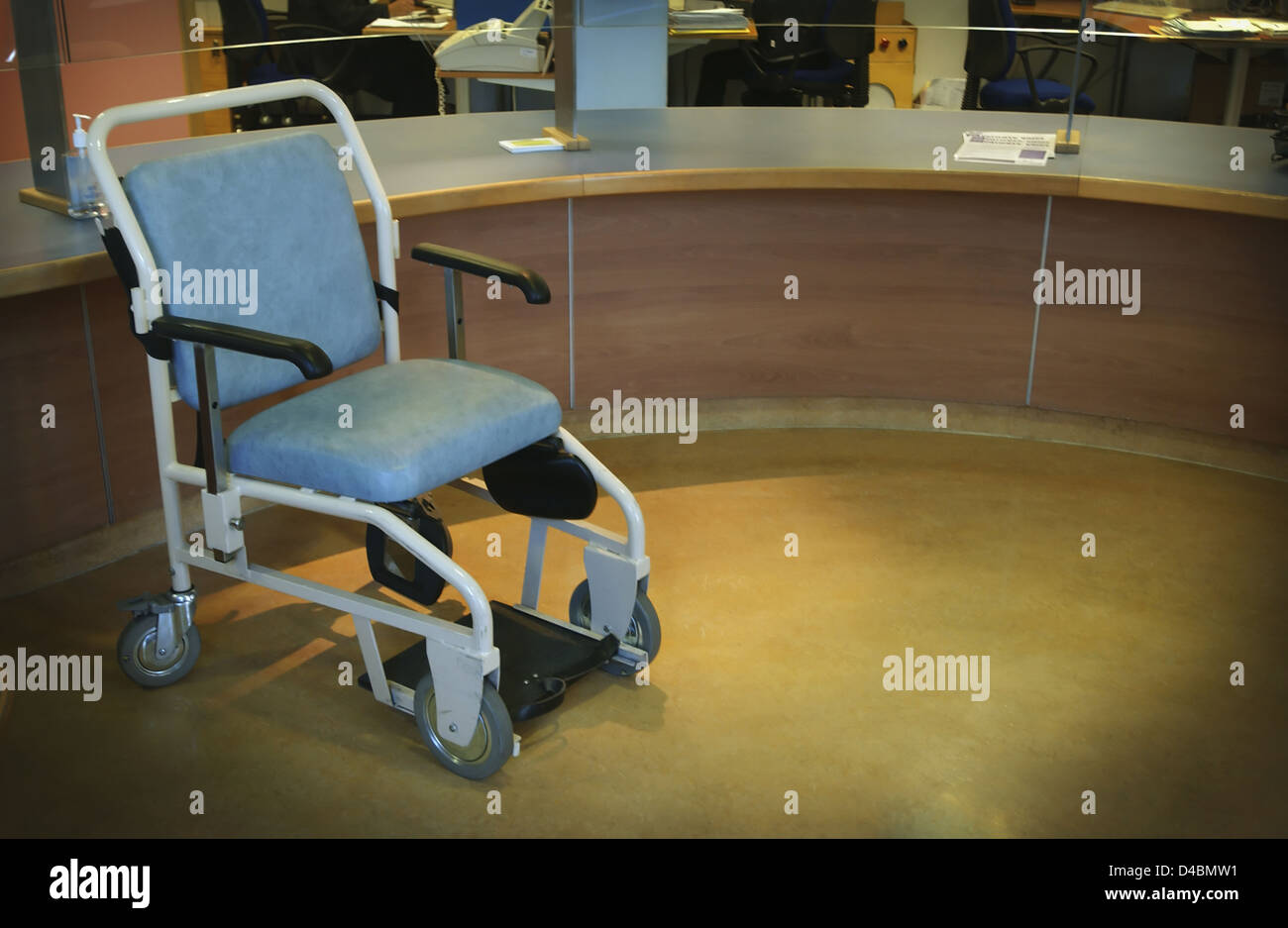 Empty wheelchair at hospital reception Stock Photo - Alamy
