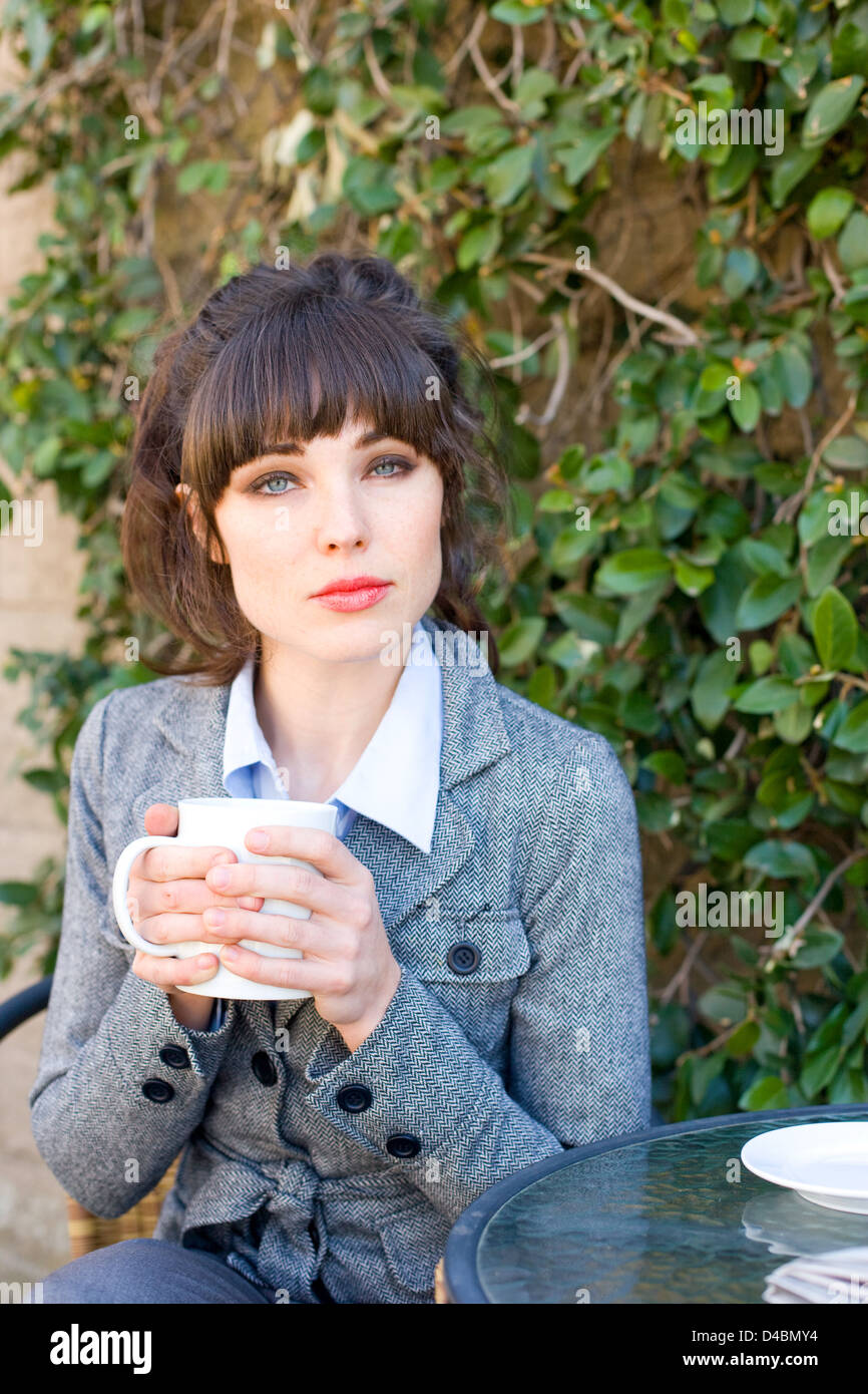 Attractive Young Business Woman Drinking Coffee At Outdoor Cafe Stock