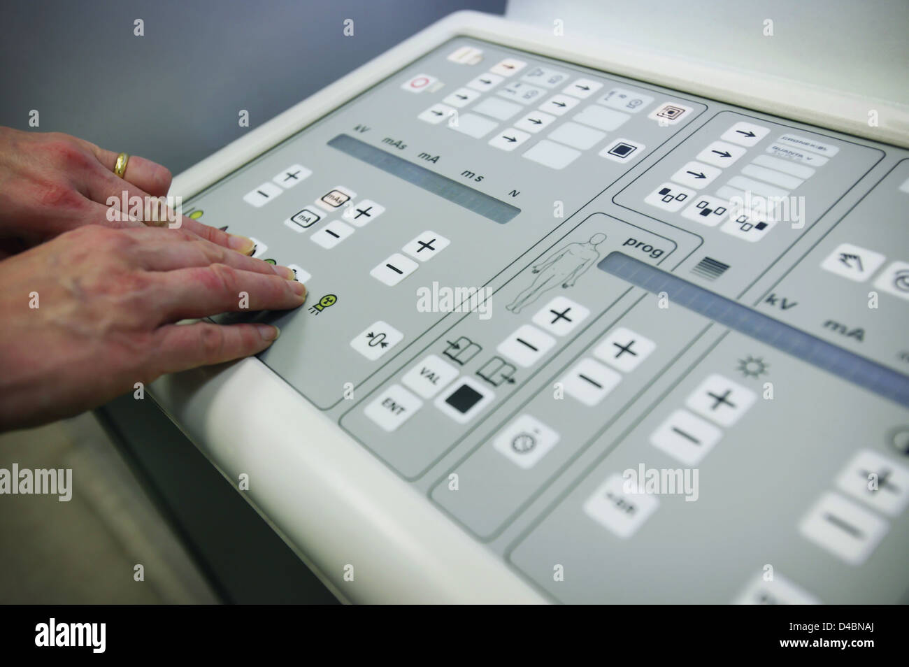 Radiographers hand preparing to use x-ray machine control panel Stock ...