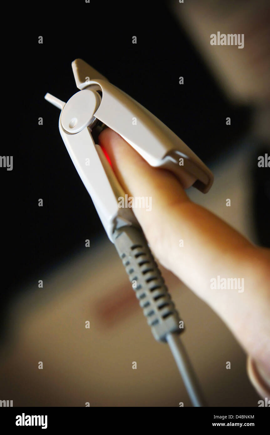 Finger heart rate monitor Stock Photo - Alamy