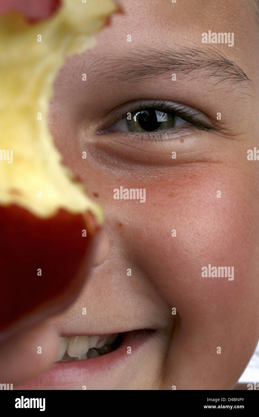 Girl holding apple in front of face hi-res stock photography and images ...