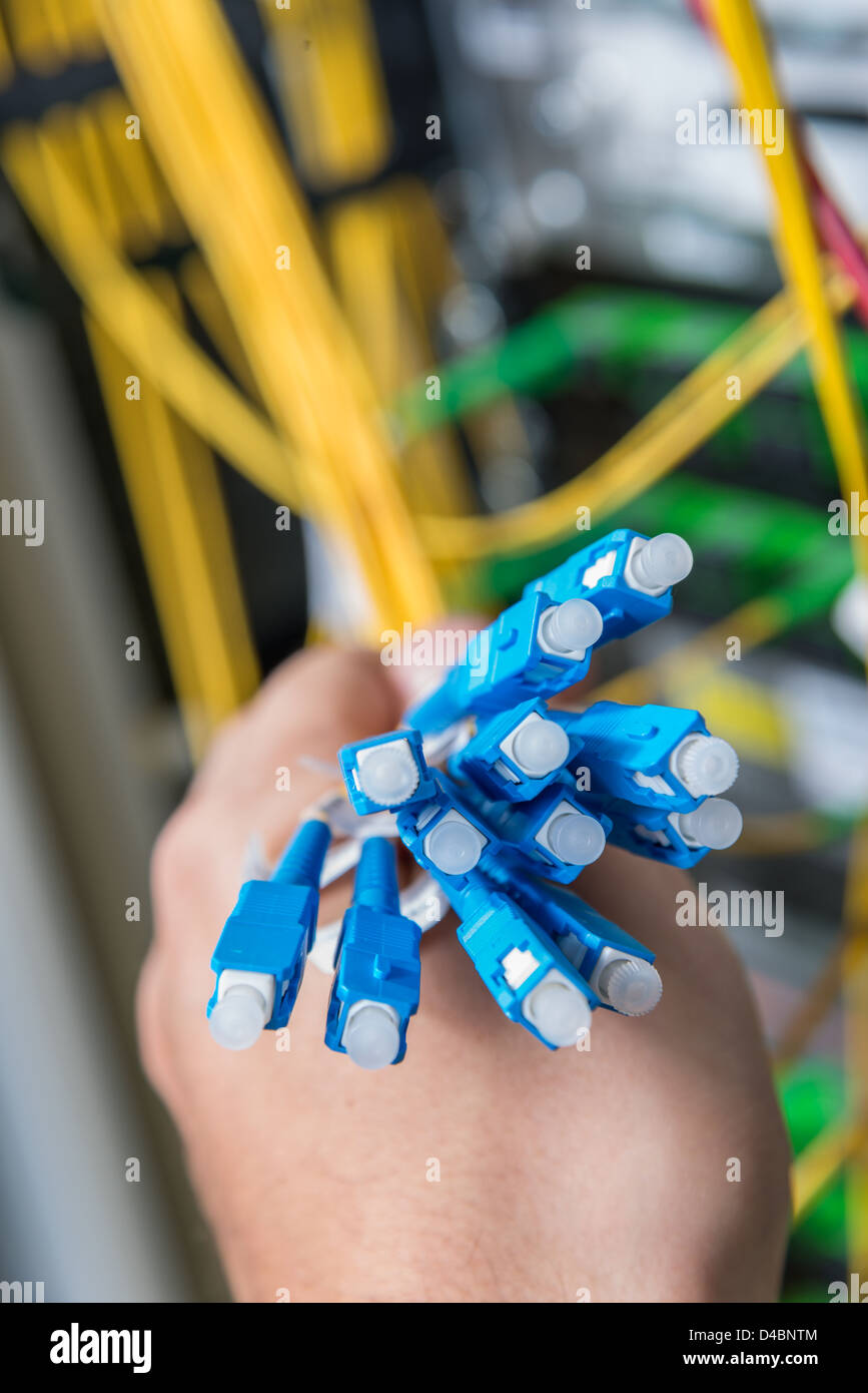 Hand holding cable bunch hi-res stock photography and images - Alamy