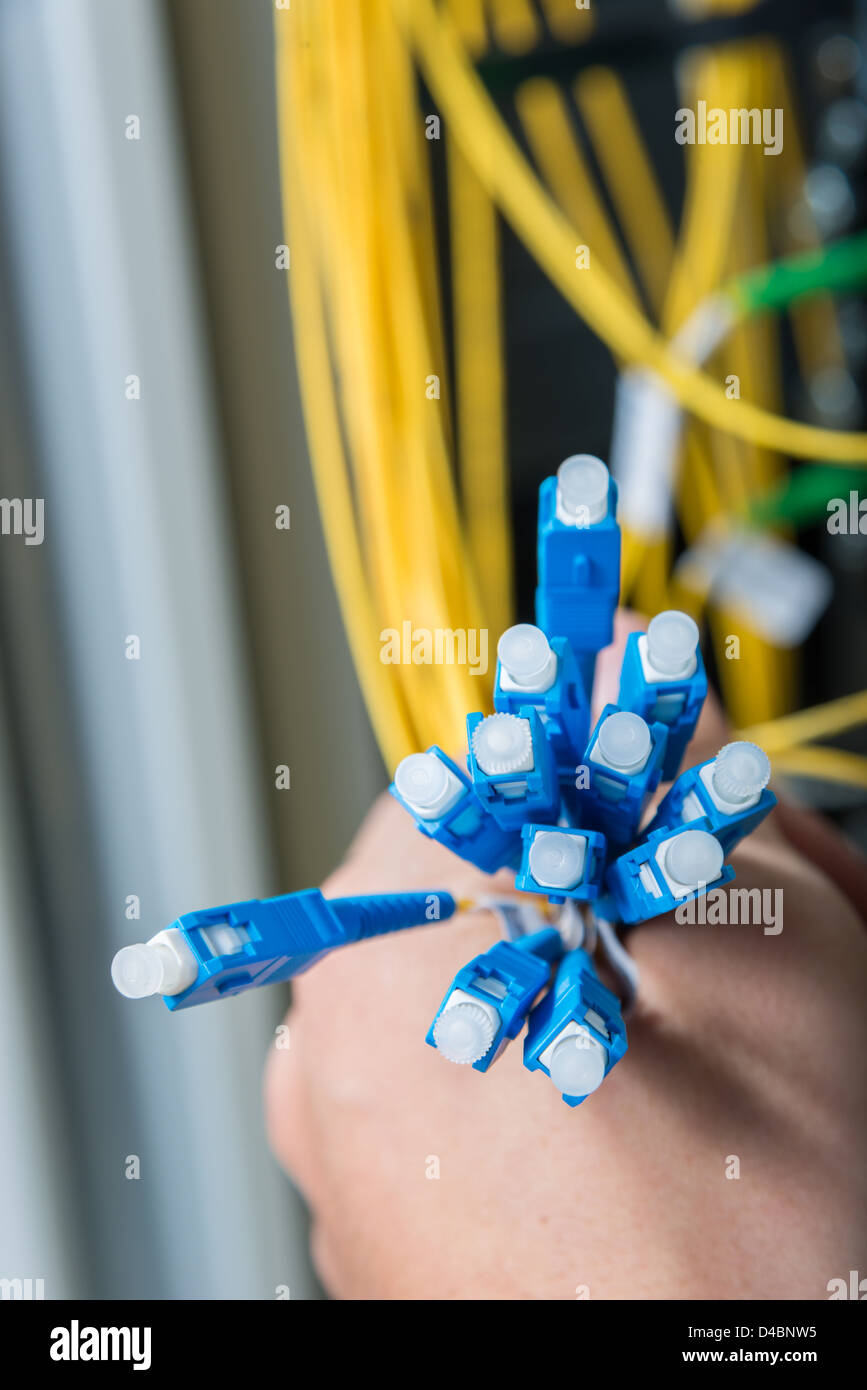 Hand holding cable bunch hi-res stock photography and images - Alamy