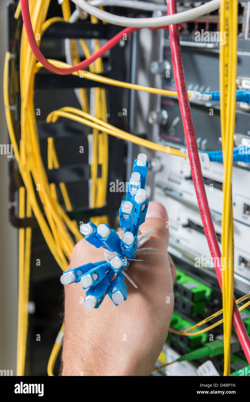 Hand holding cable bunch hi-res stock photography and images - Alamy