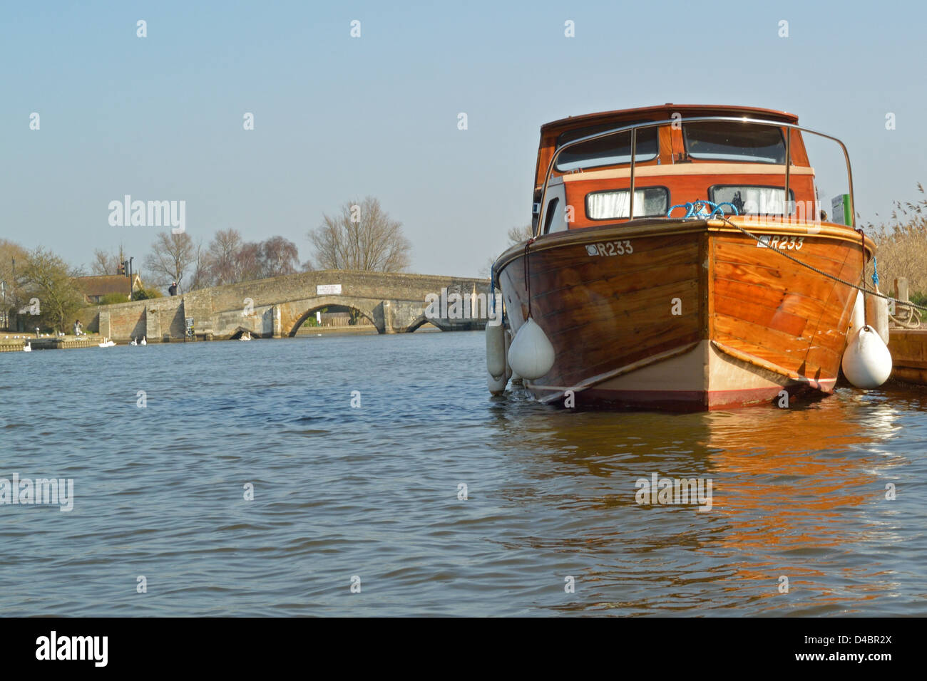 River Thurne, Norfolk, with a classic 1960s wooden Broads cruiser and ...