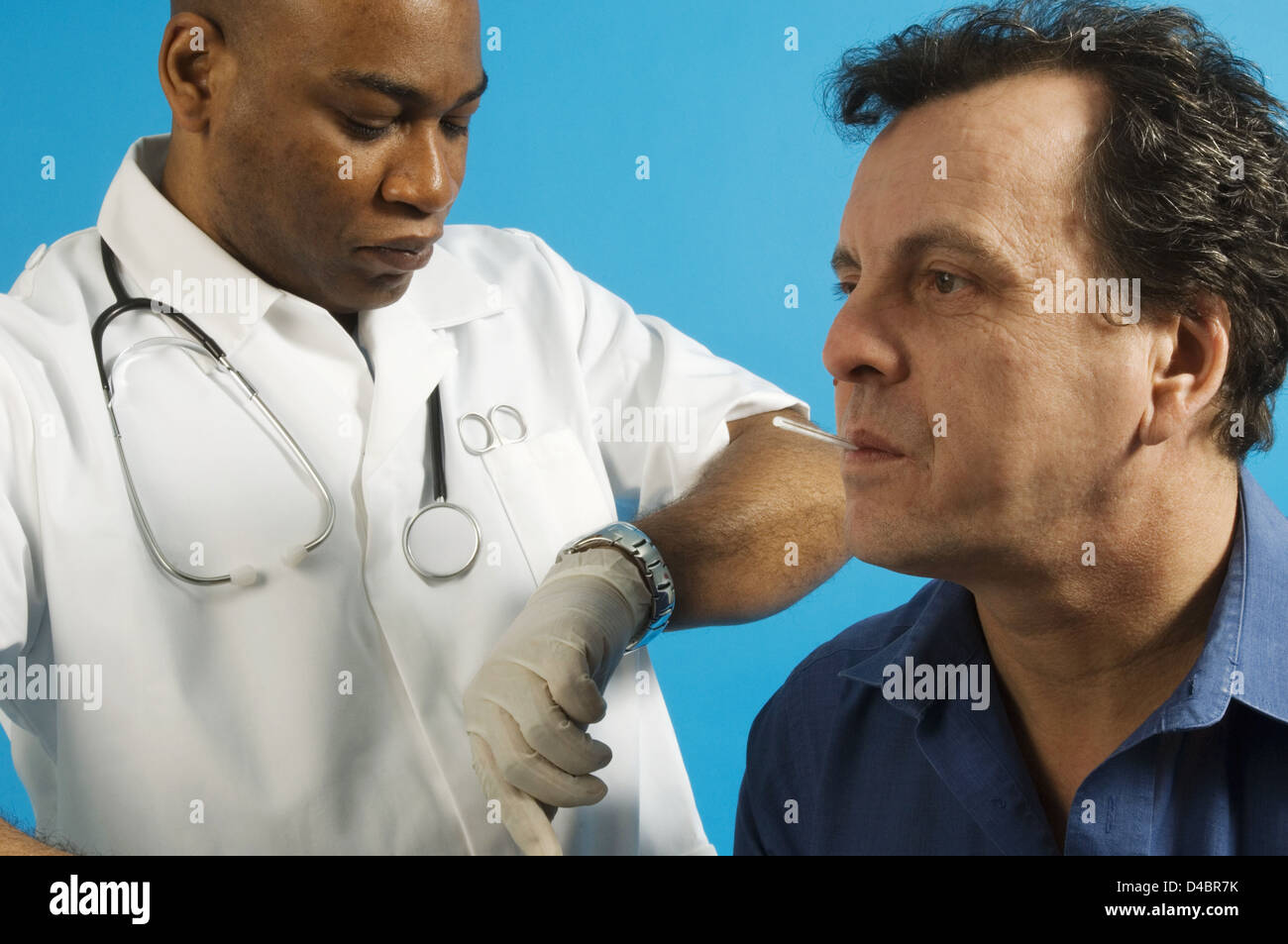 Male caucasian doctor checking patients pulse hi-res stock photography ...