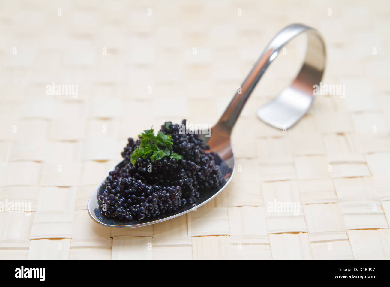 Caviar on a spoon Stock Photo - Alamy