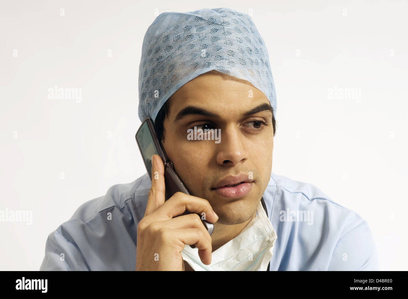 Surgeon talking on his mobile phone Stock Photo - Alamy