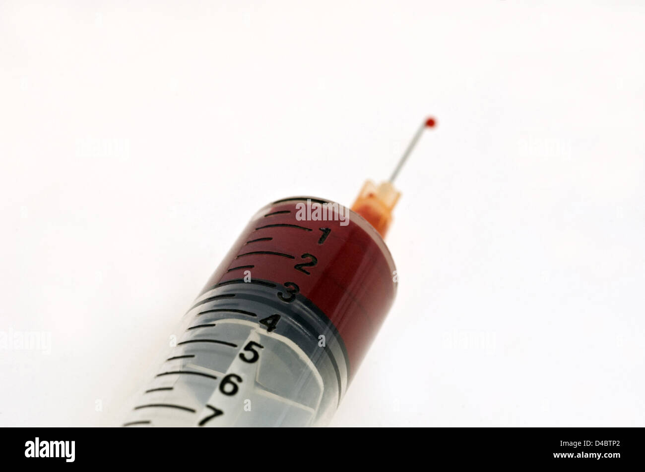 Close-up of syringe with red liquid Stock Photo - Alamy