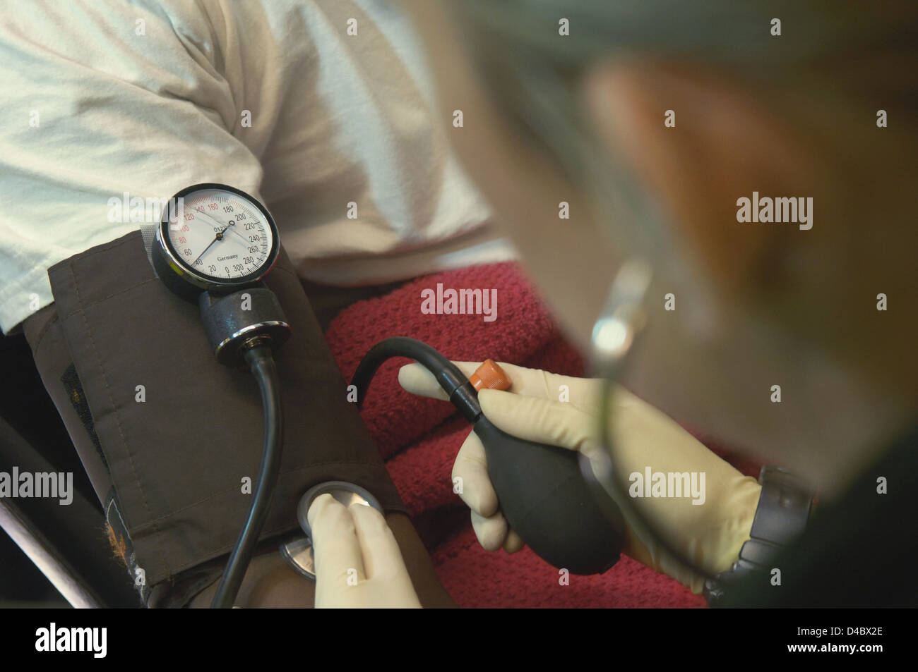 Paramedic measuring blood pressure of patient Stock Photo - Alamy Paramedic measuring blood pressure of patient Stock Photo - Alamy