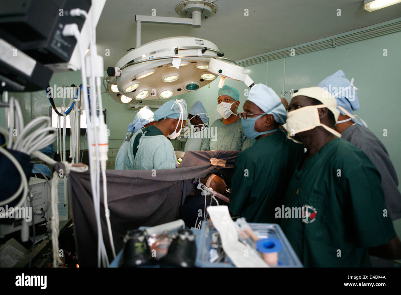 Surgeons watching monitor as an endoscopic operation is performed Stock ...