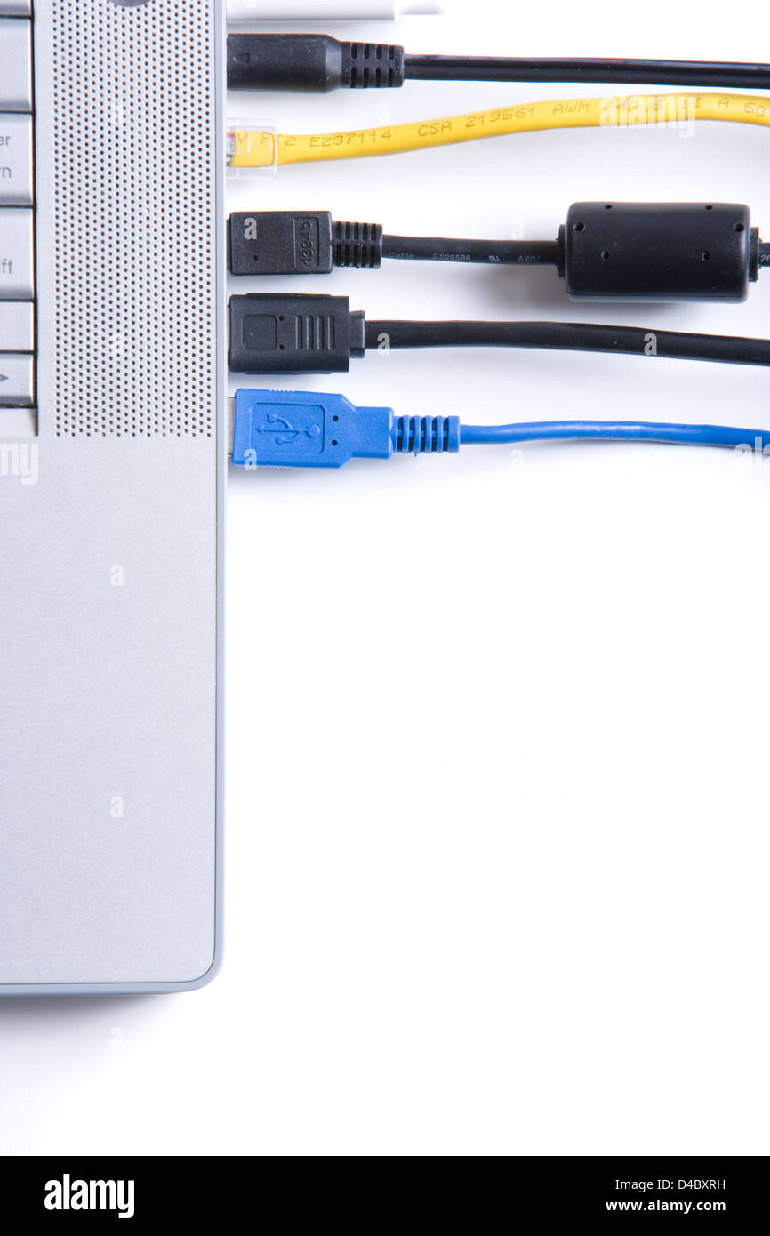 Wires connected to a modern laptop isolated on white Stock Photo - Alamy