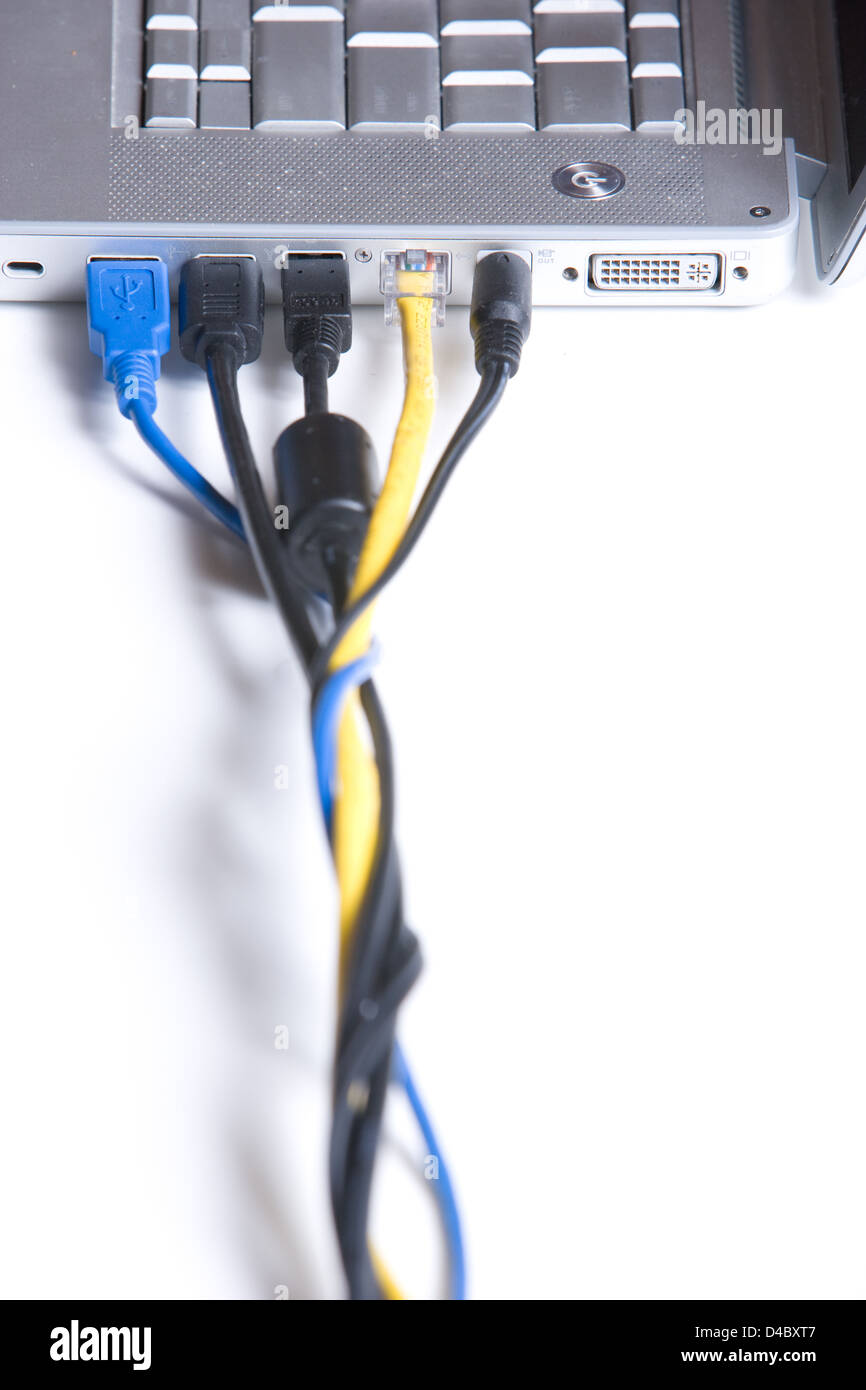 Wires connected to a modern laptop isolated on white Stock Photo - Alamy