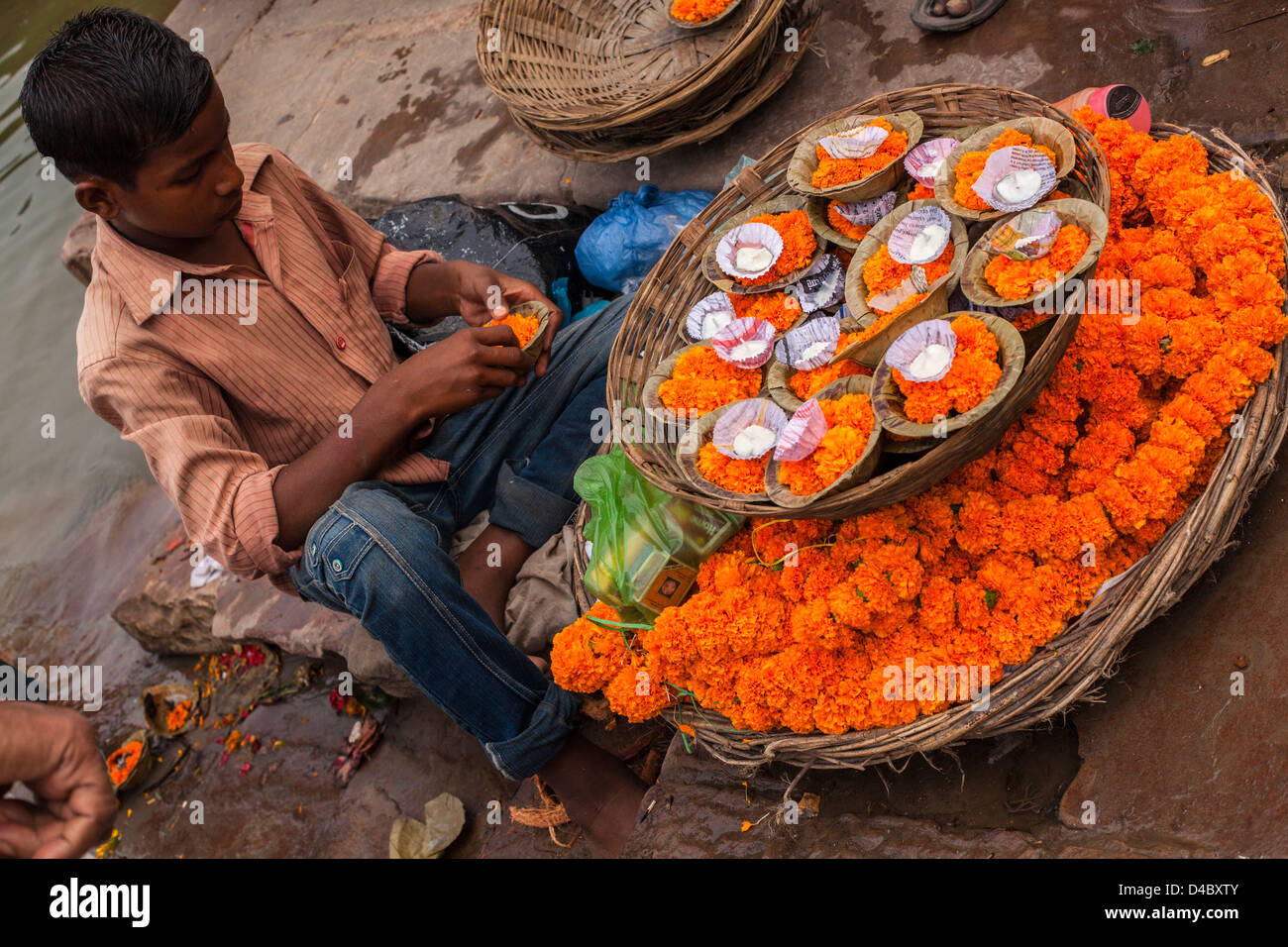 Child selling flowers hi-res stock photography and images - Alamy