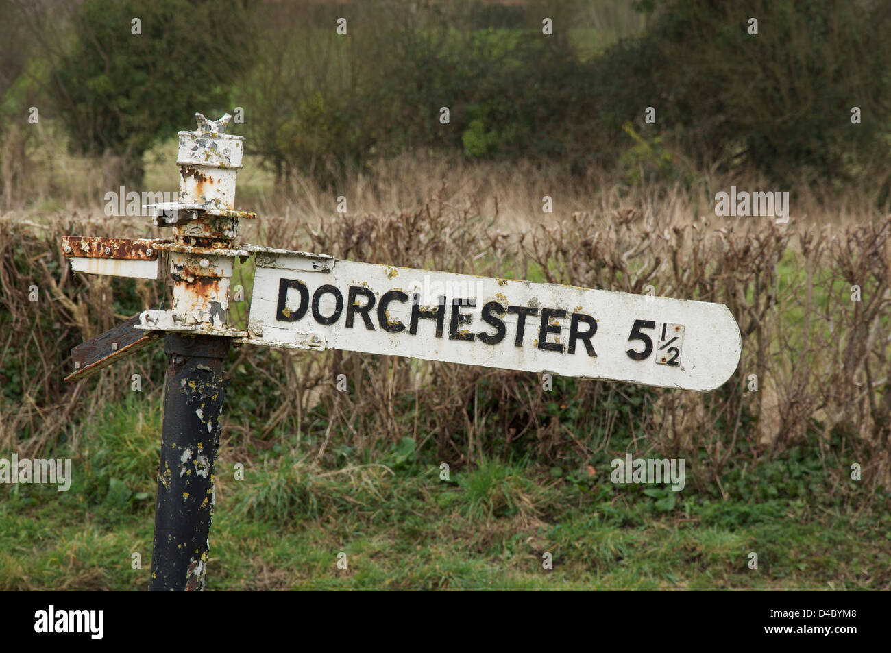 English road sign. “Dorchester 5 ½ miles”. A dilapidated old fingerpost ...