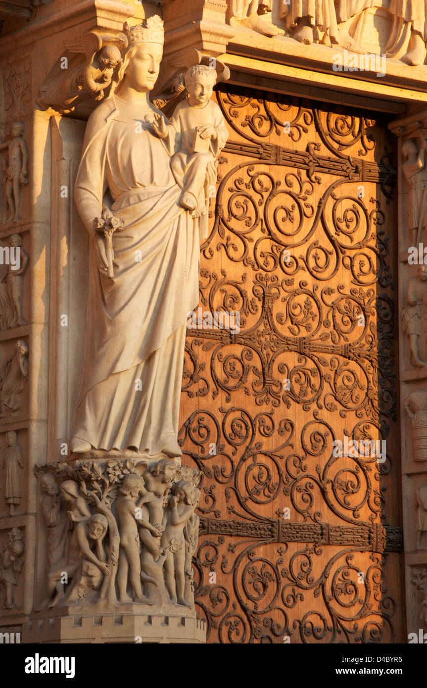 Our Lady of Paris. A statue of Mary and the infant Jesus on the trumeau ...