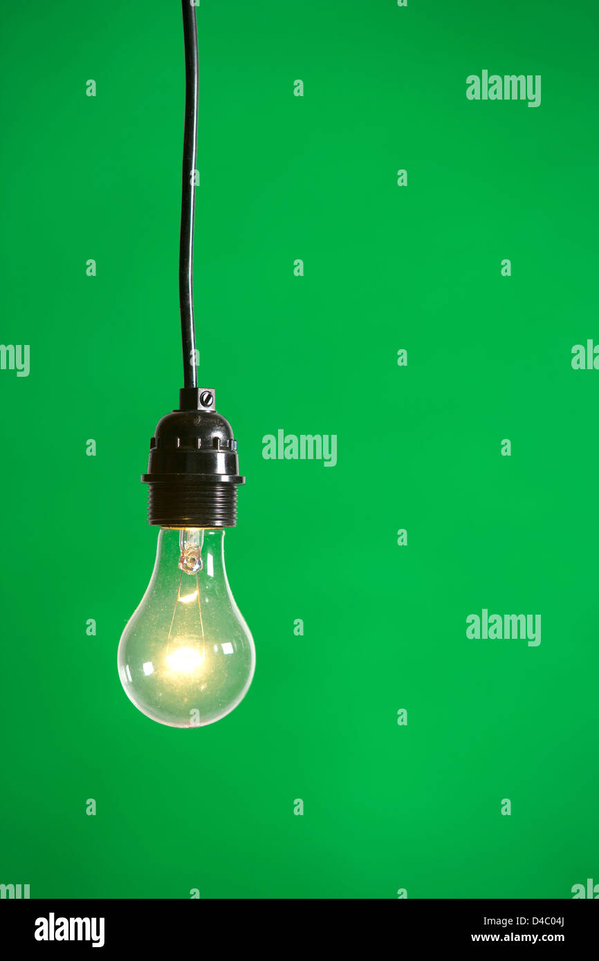 Green Light isolated hanging in the studio Stock Photo - Alamy