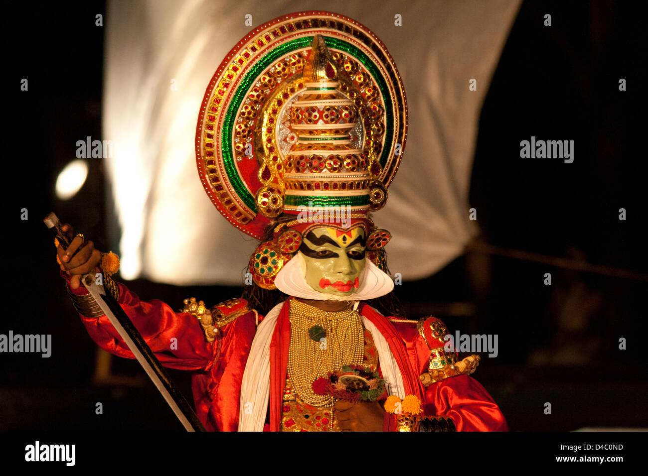 A sword-wielding Pacca acts out his part in a traditional Kathakali ...