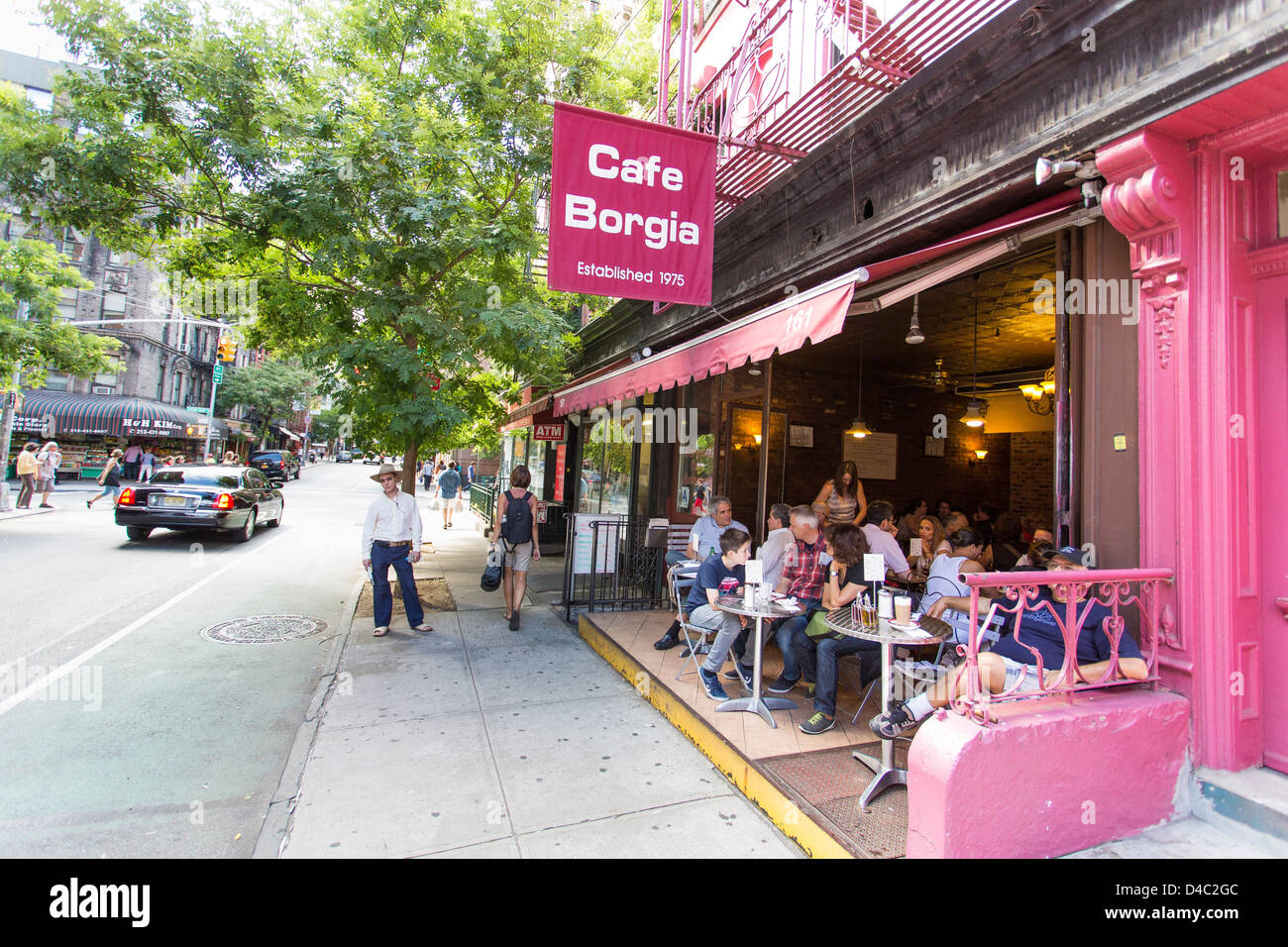 People enjoying their time while seating outside of Cafe Borgia ...