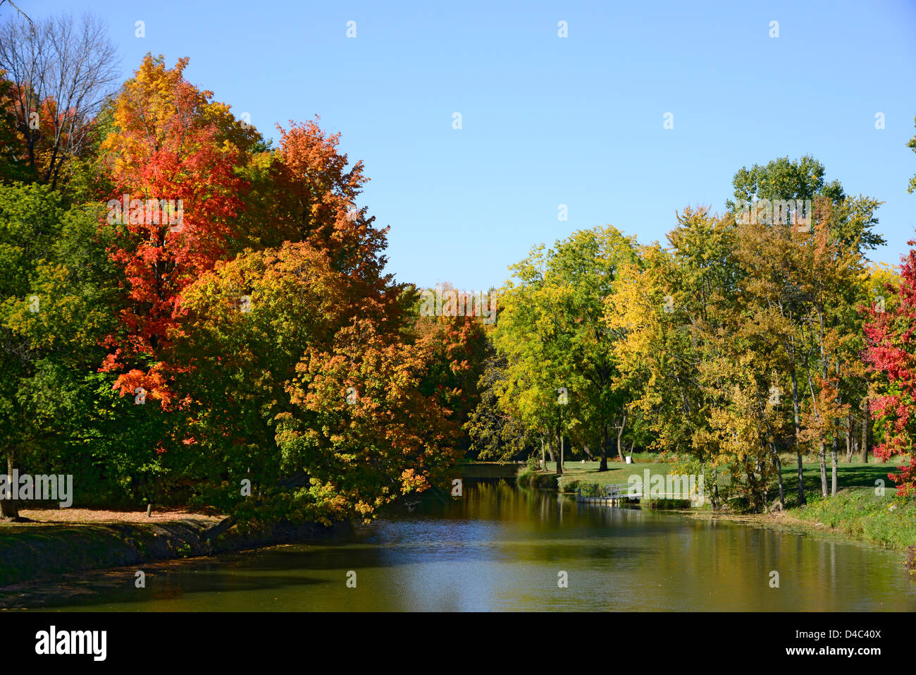 Trees changing color along shore hi-res stock photography and images ...