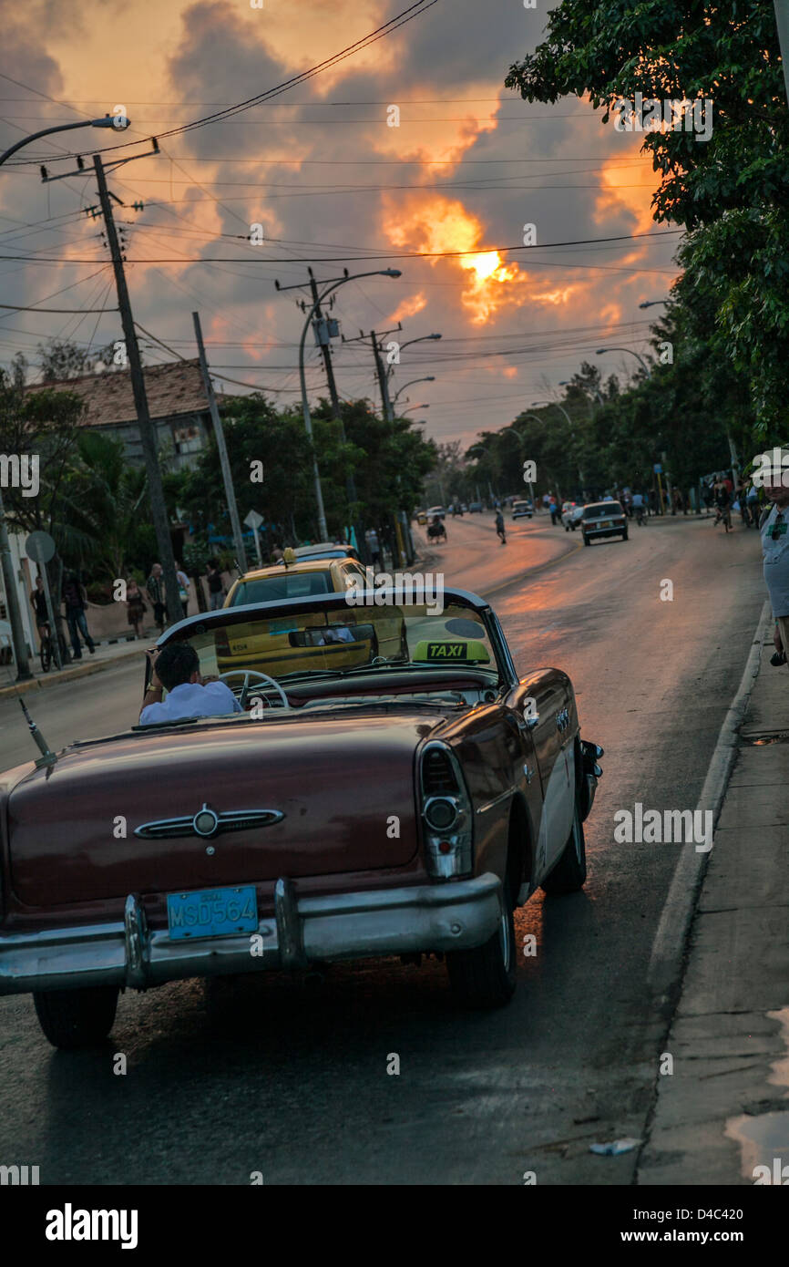 A taxi driver driving his car at dusk in Varadero Cuba Stock Photo - Alamy