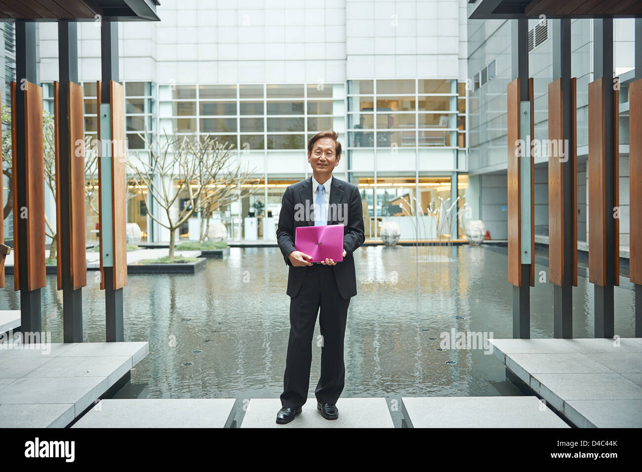 Jonney Shih, Chairman of ASUS, holding an ASUS ZENBOOK inside the Zen ...