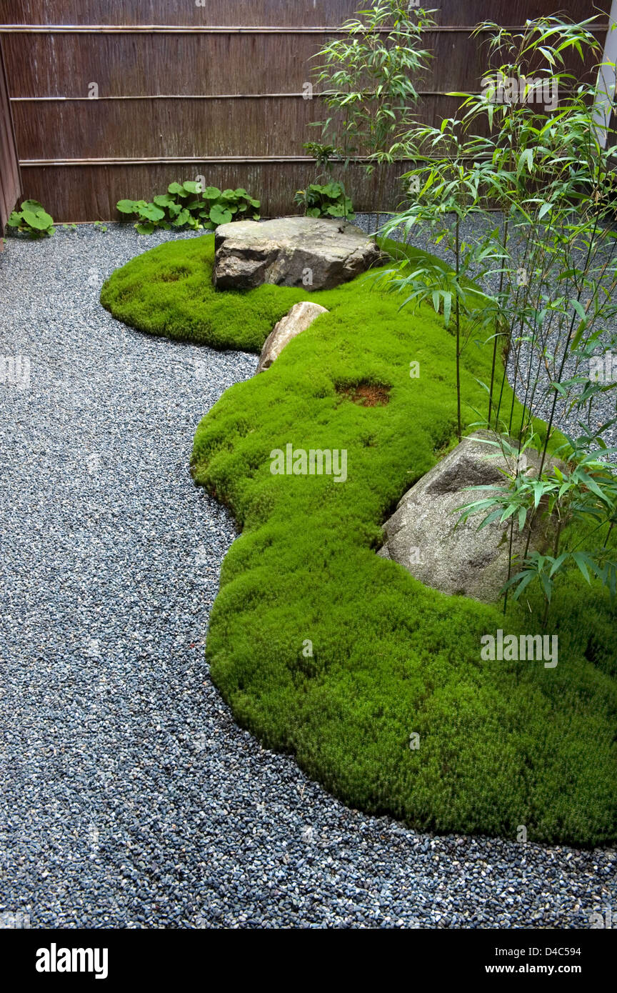 A carefully manicured moss island highlights a "karesansui" dry ...