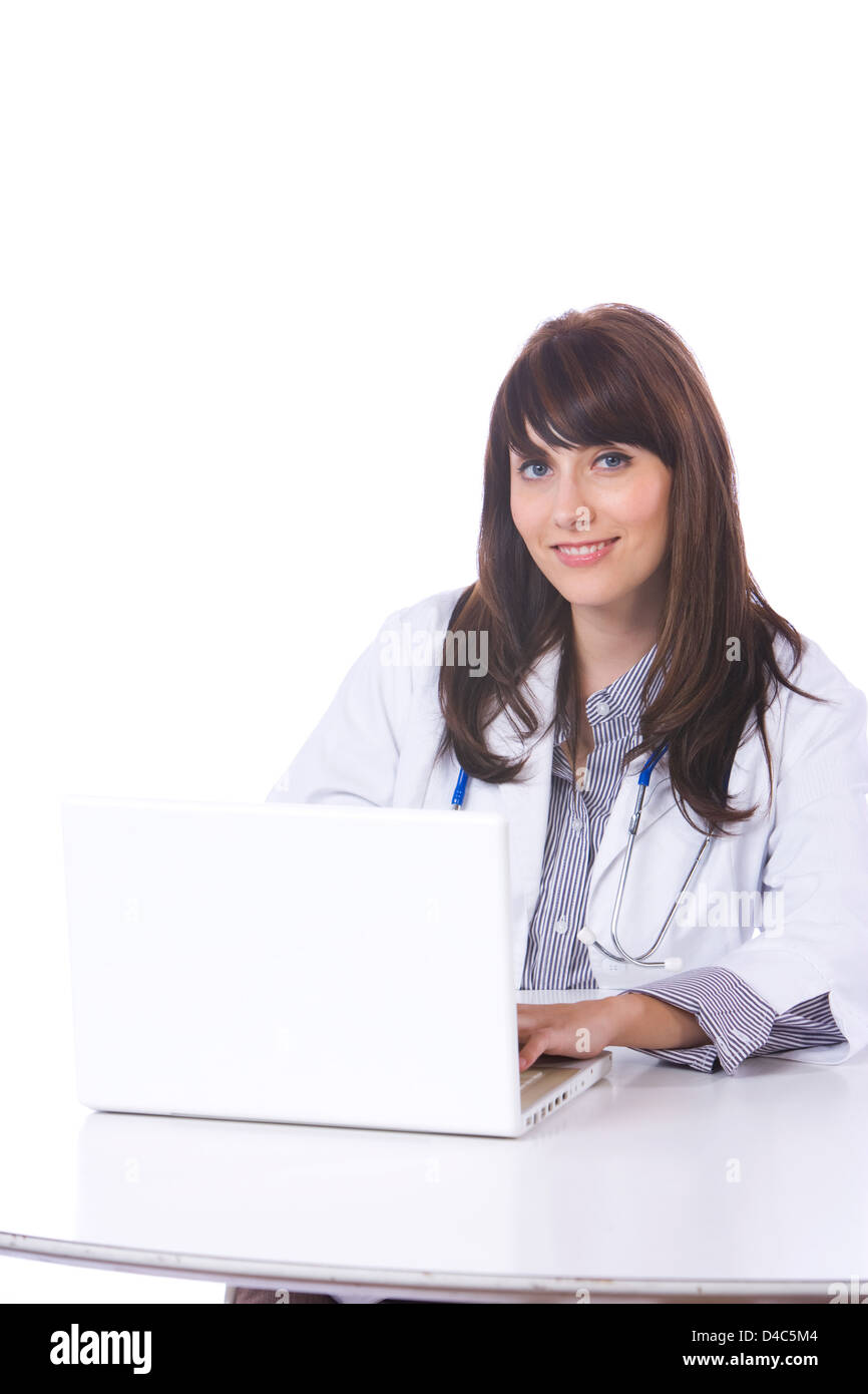 Female doctor on computer at desk isolated on white Stock Photo - Alamy
